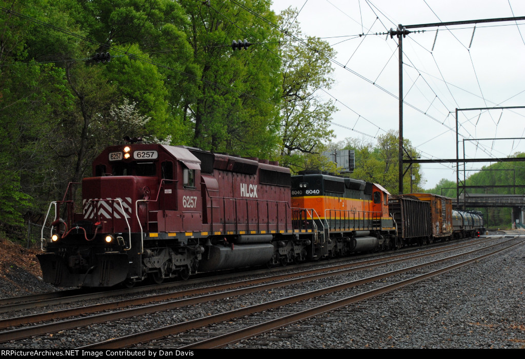 HLCX SD40-2 6257 in Red and White leads Q300-22